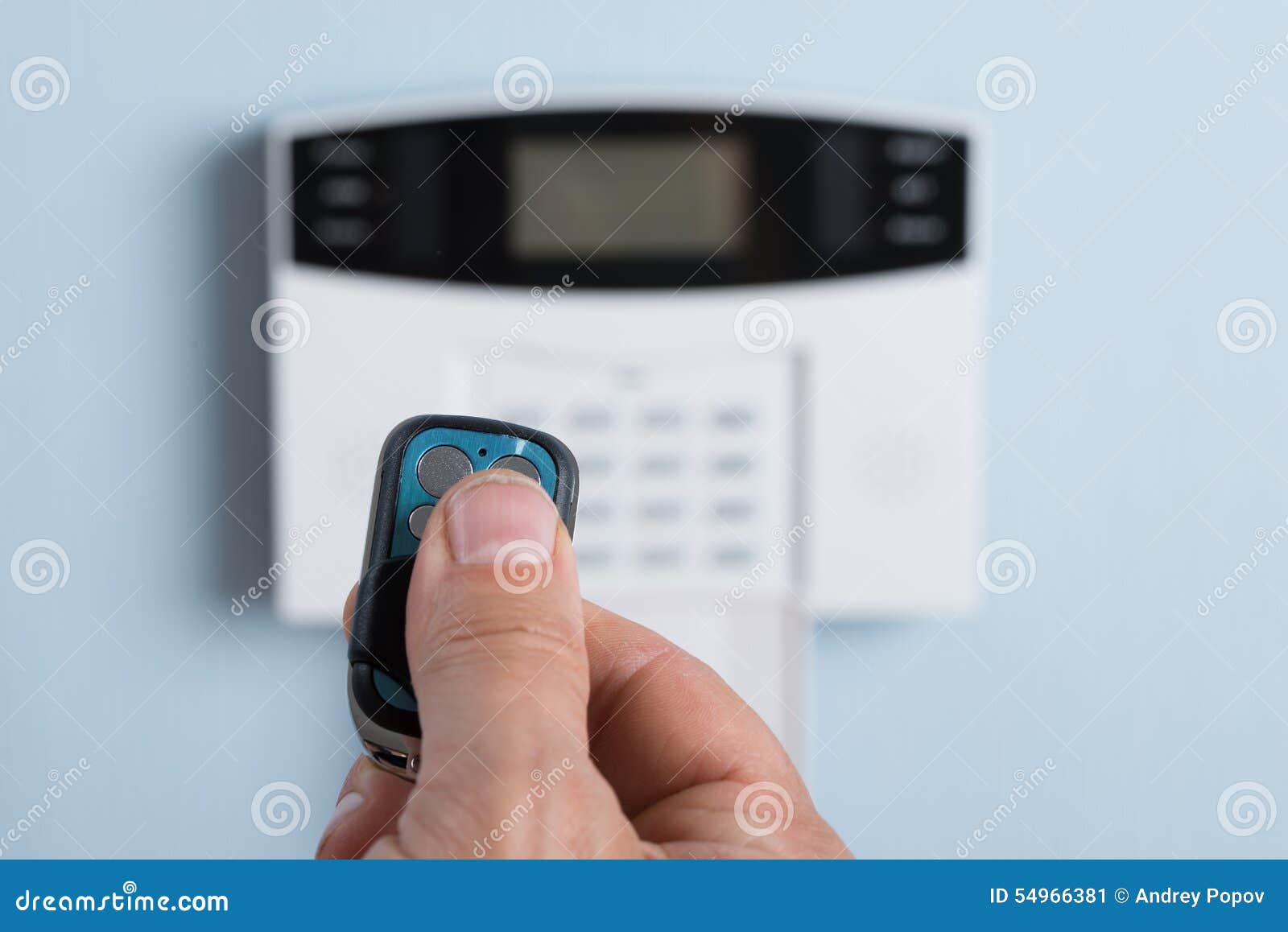 Person Using Remote Control To Disarm the Security System Stock Image ...