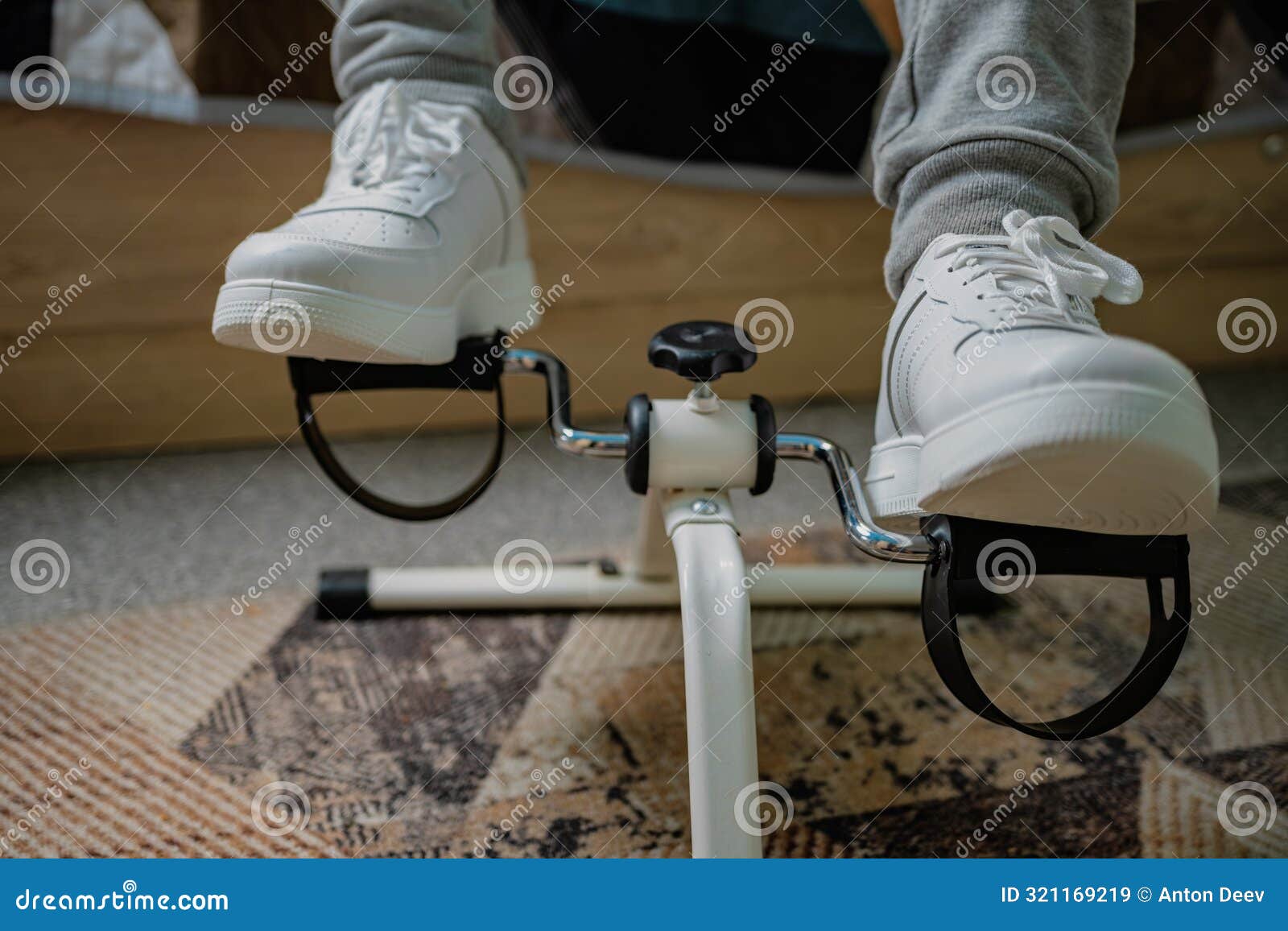 Person Using White Peddler Exercise Machine while Sitting Stock Image ...