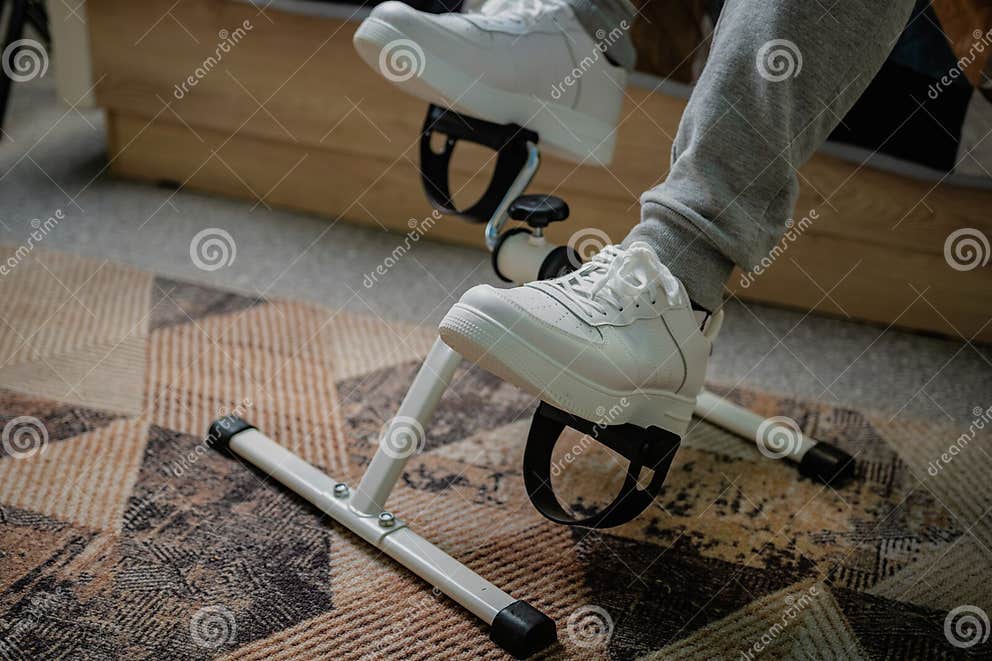 Person Using White Peddler Exercise Machine while Sitting Stock Image ...