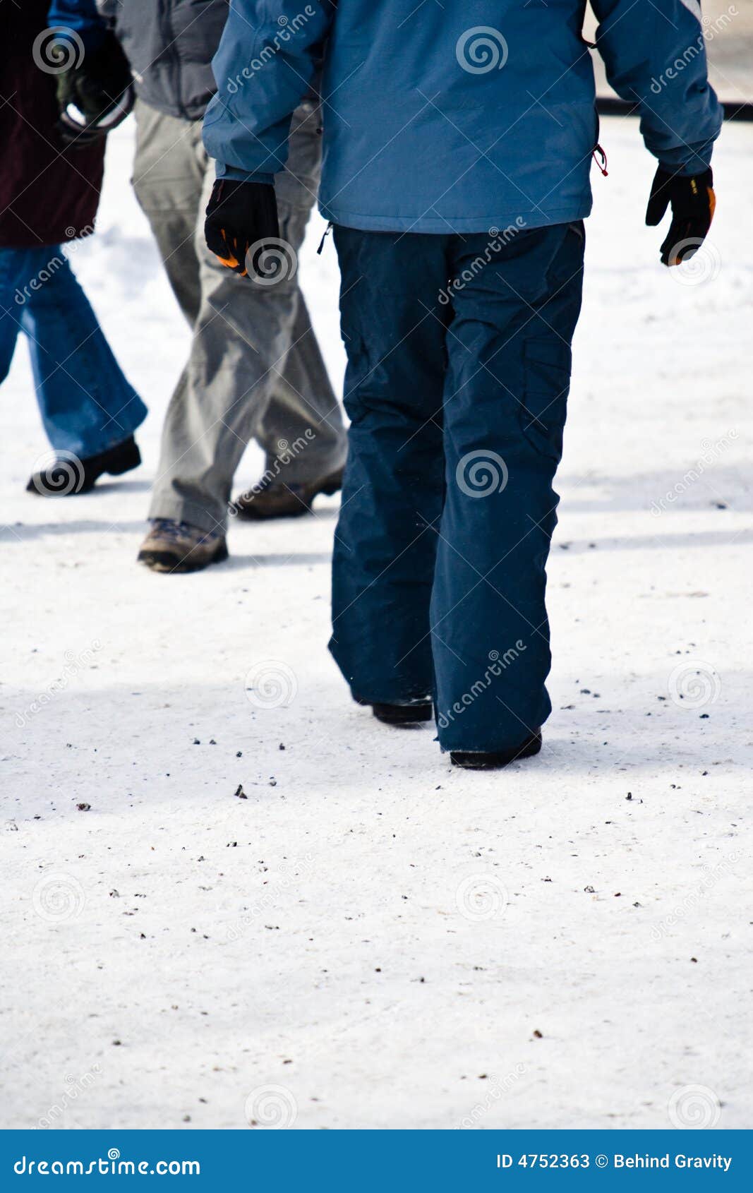 A Person Walking on a Snow Covered Path at a Ski R Stock Image - Image ...