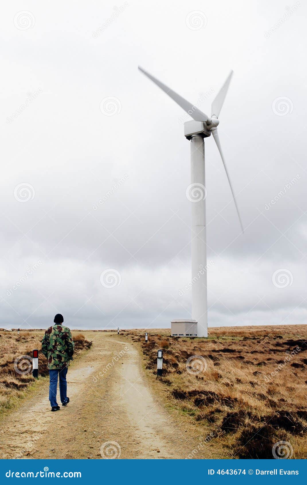Person Walking Towards Wind Turbine Stock Photo - Image of metal ...