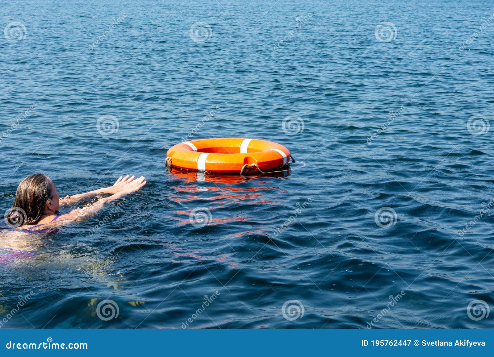 A Person in the Water Gets a Lifeline To Help. the Concept of Saving ...
