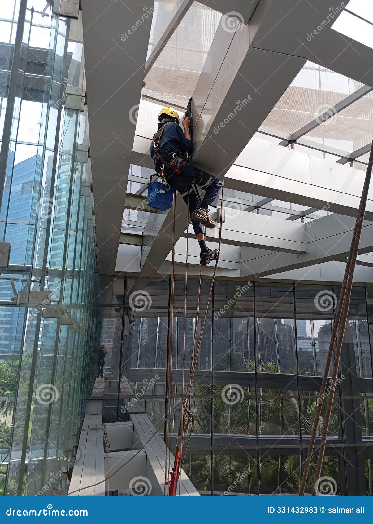 A Person is Working at Height Using Rope Access Stock Image - Image of ...