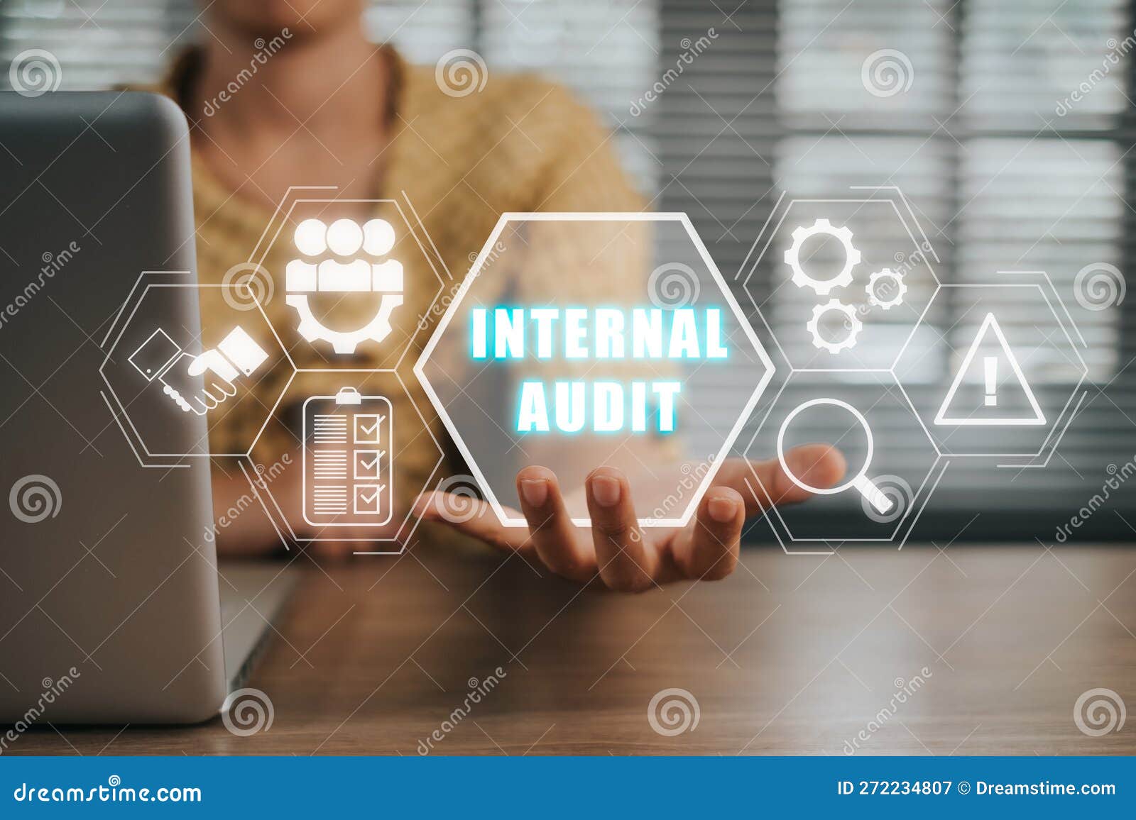 Person Working on Laptop Computer and Hand Holding Internal Audit Icon ...