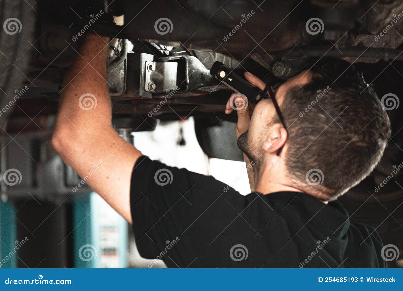 Person Working Under a Car and Repairing Stock Image - Image of ...