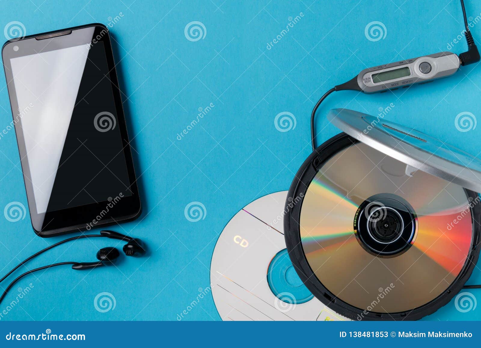 Personal Cd Player with Remote Control and Modern Smartphone on Blue ...