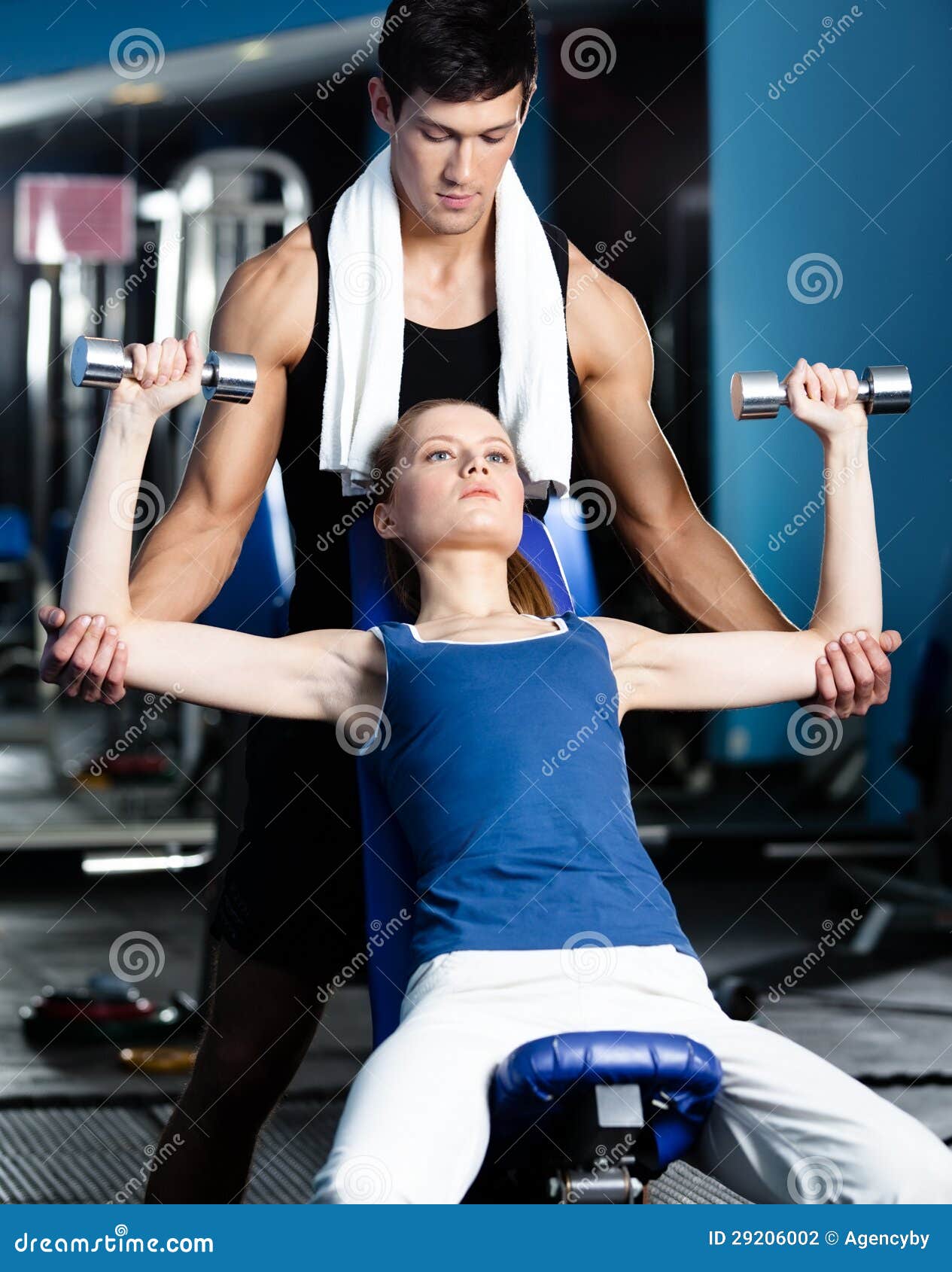 Personal Coach Helps Woman To Exercise with Weights Stock Photo - Image ...