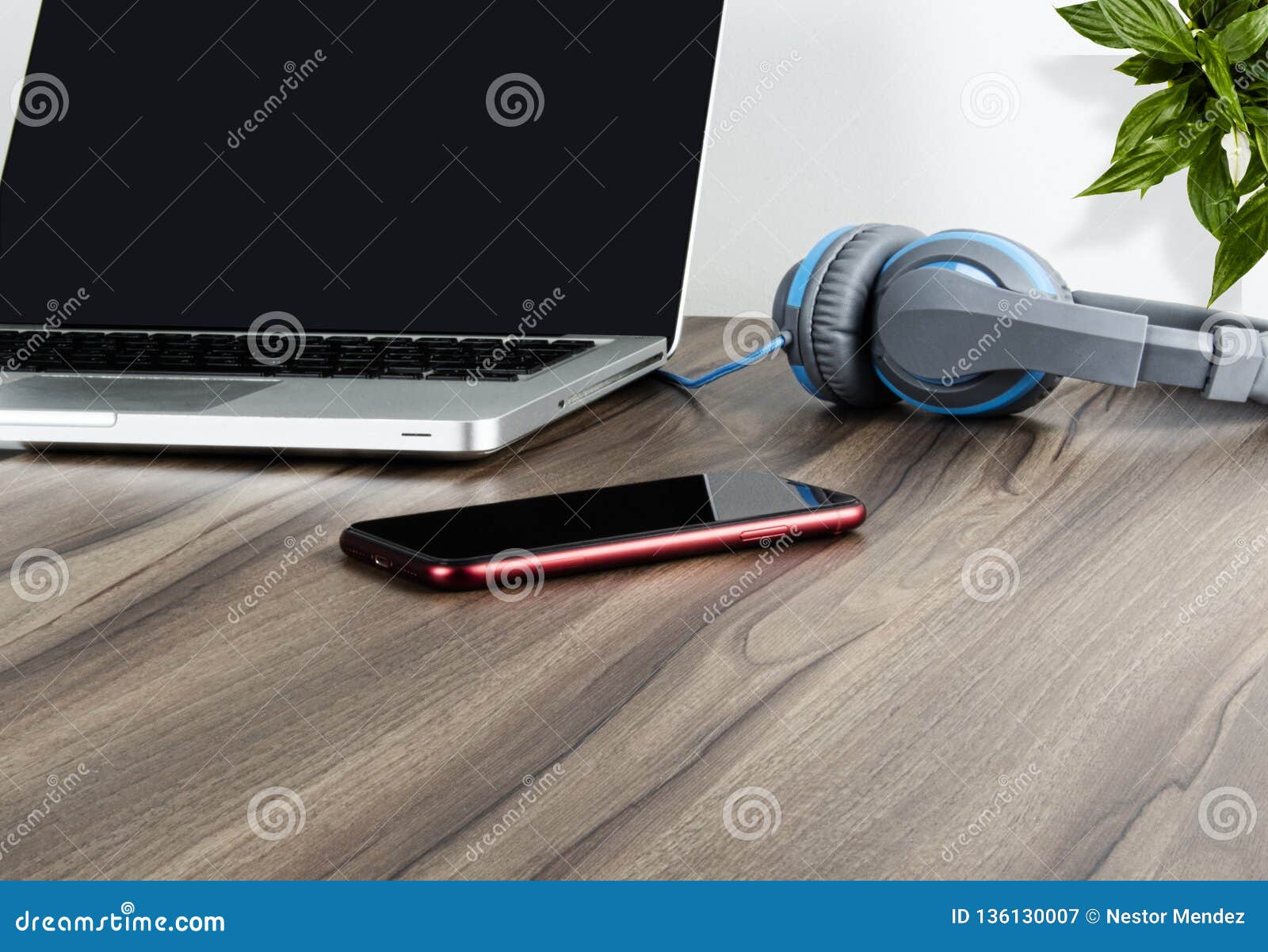 Personal Computer on a Table. Cell Phone and Headphones Stock Image ...