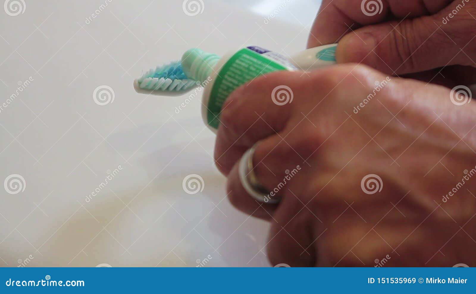 Personal Hygiene with Hands Squeezing Toothpaste on the Toothbrush ...
