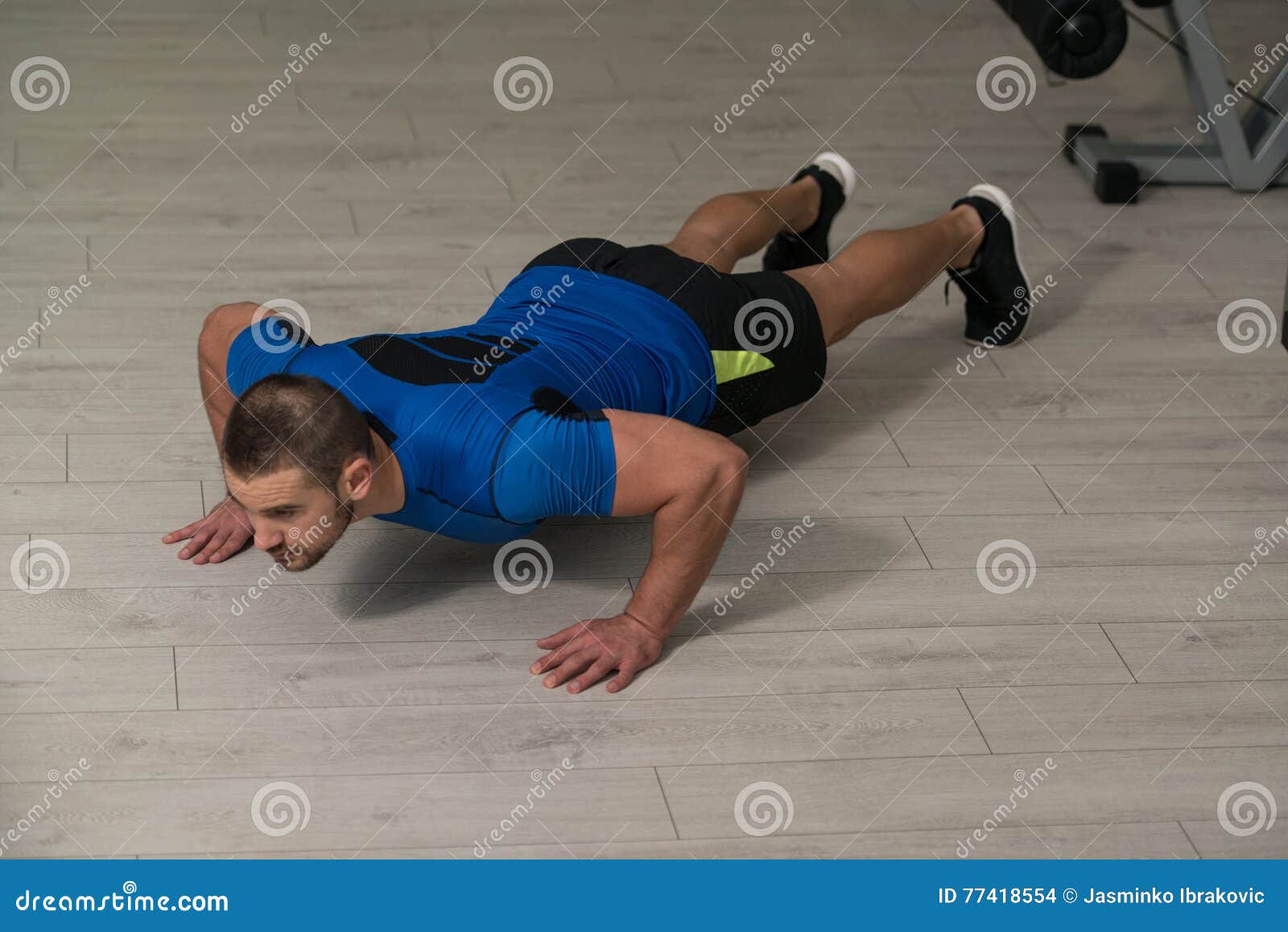 Personal Trainer Doing Push-ups on Floor in Gym Stock Photo - Image of ...