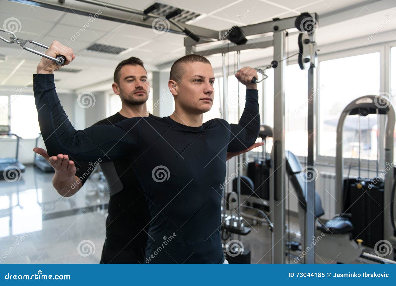 Personal Trainer Helping Client in Gym Stock Image - Image of muscular ...