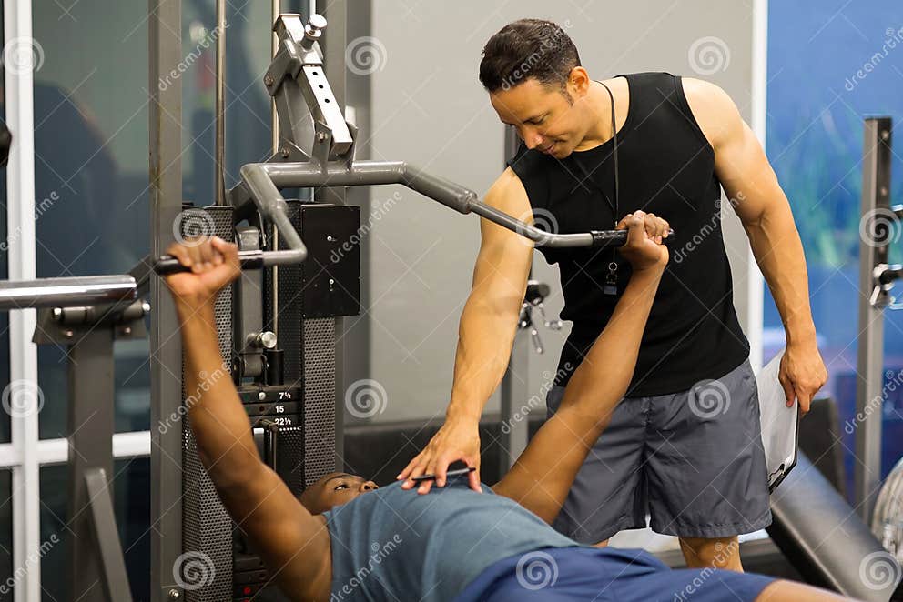 Personal Trainer Helping Client Stock Photo - Image of lifestyle ...