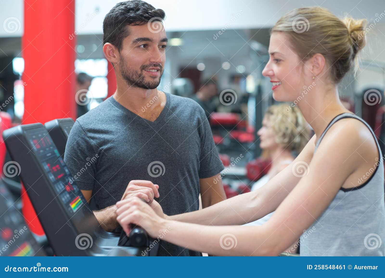 Personal Trainer Helping Woman in Gym Stock Image - Image of center ...