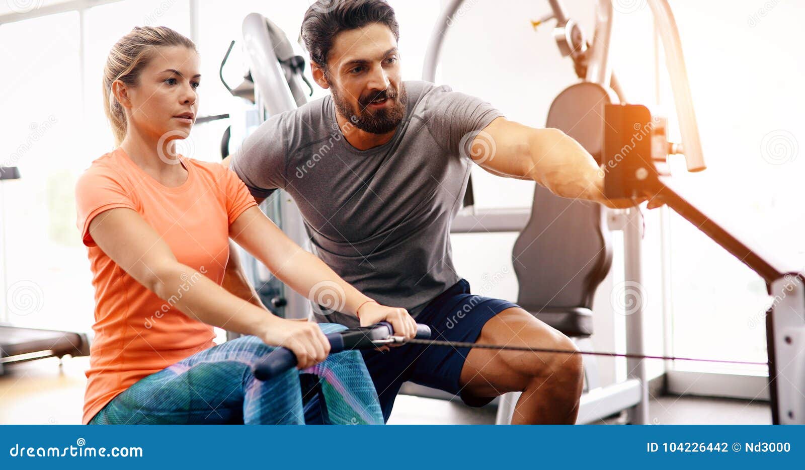 Personal trainer helping stock photo. Image of fitness - 104226442