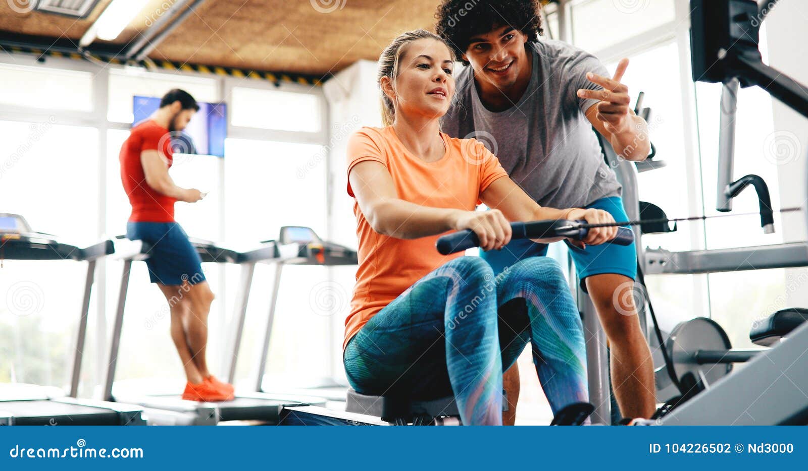 Personal trainer helping stock photo. Image of body - 104226502