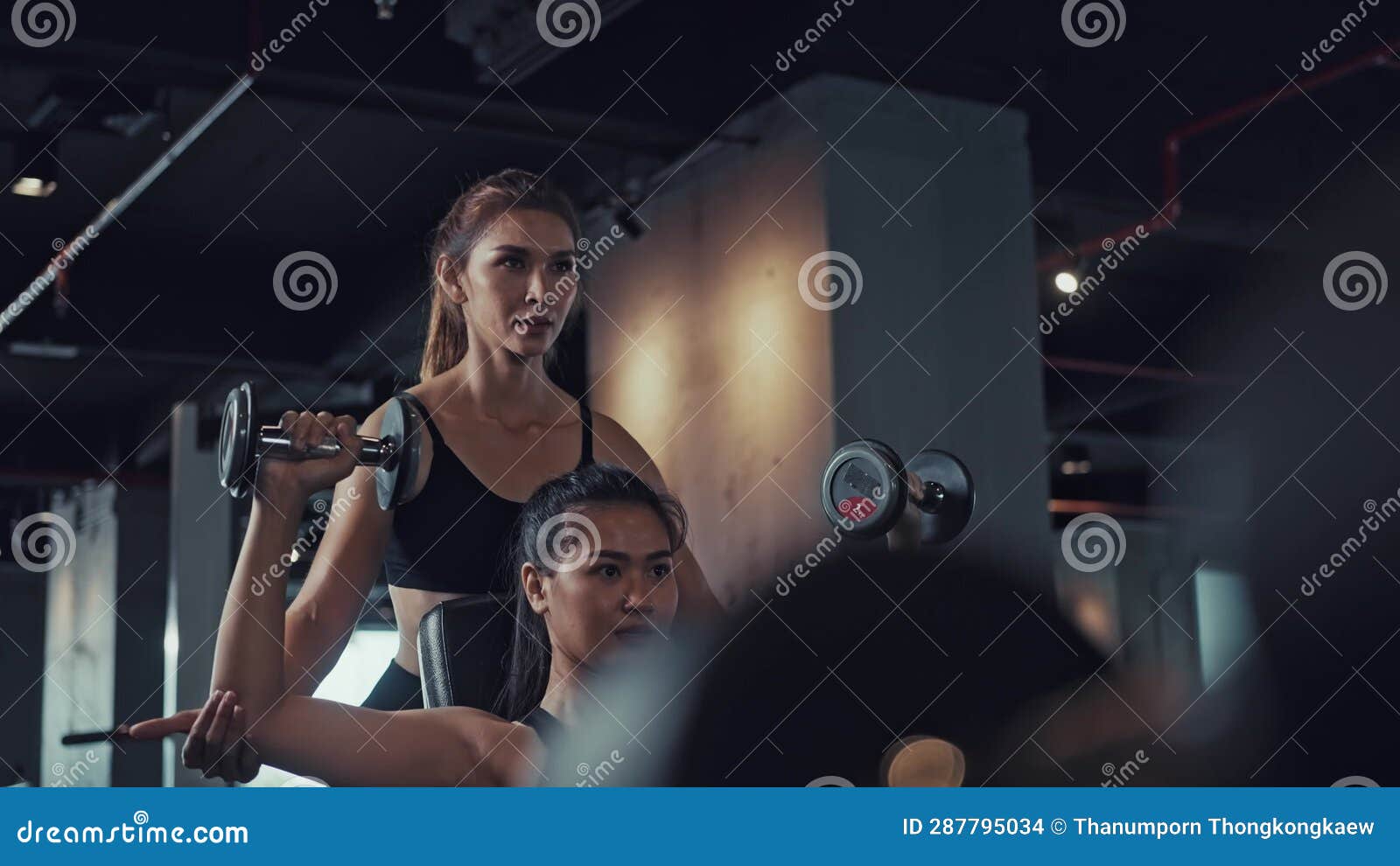 Personal Trainer Helps Her Client To Work Out in the Gym and Do ...