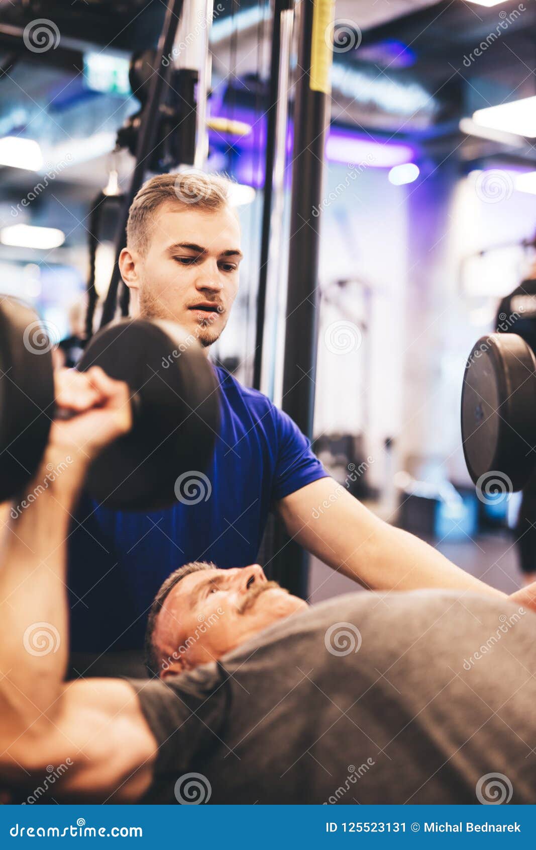 Personal Trainer Instructing Older Man during Exercise. Stock Image ...