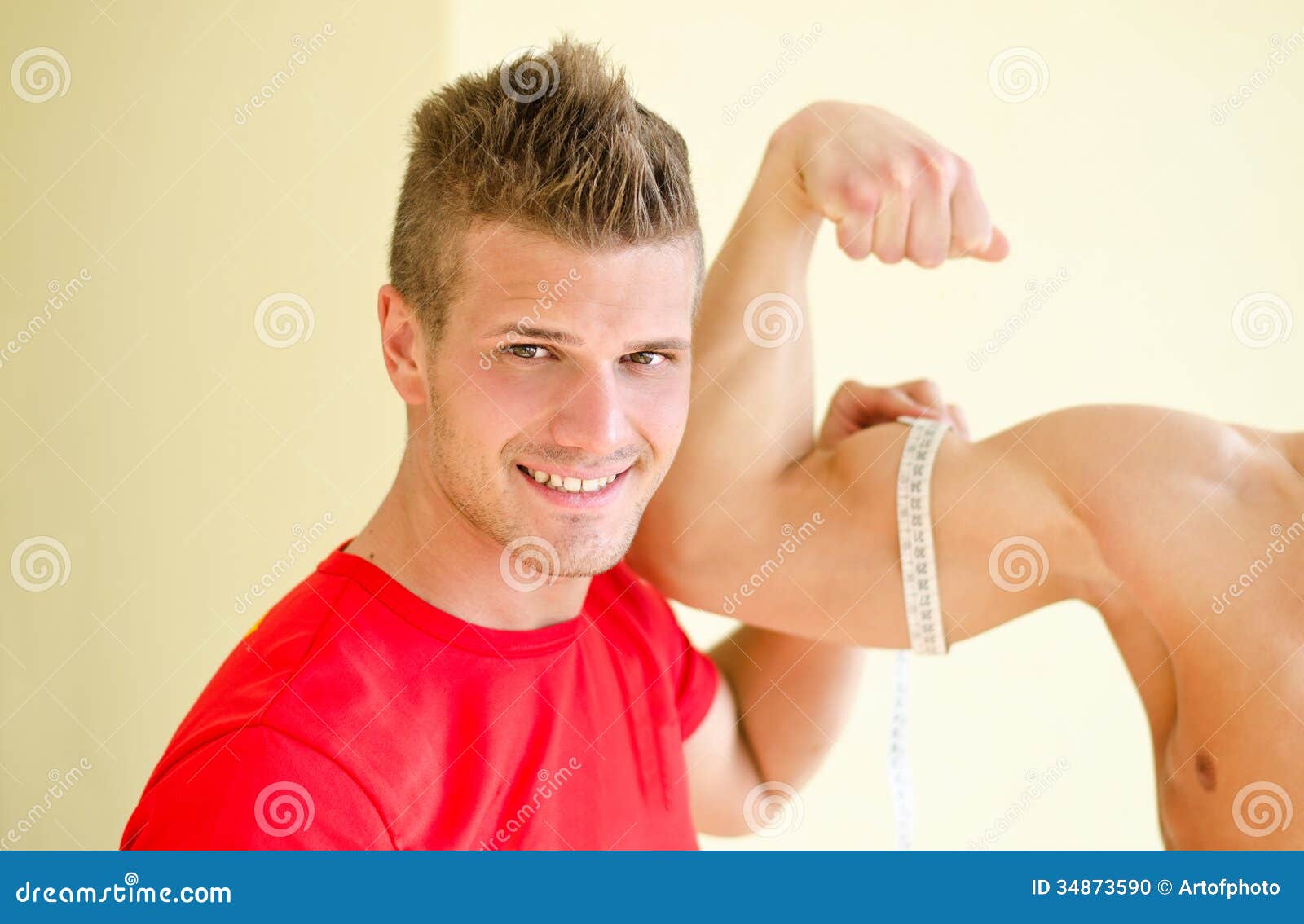 Personal Trainer Measuring Client Bicep with Tape Meter Stock Photo ...
