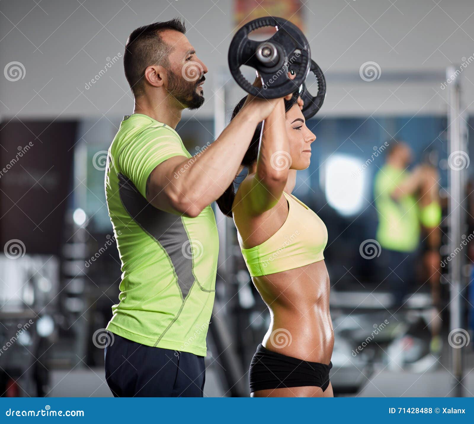 Personal Trainer at Shoulder Workout Stock Photo - Image of female ...