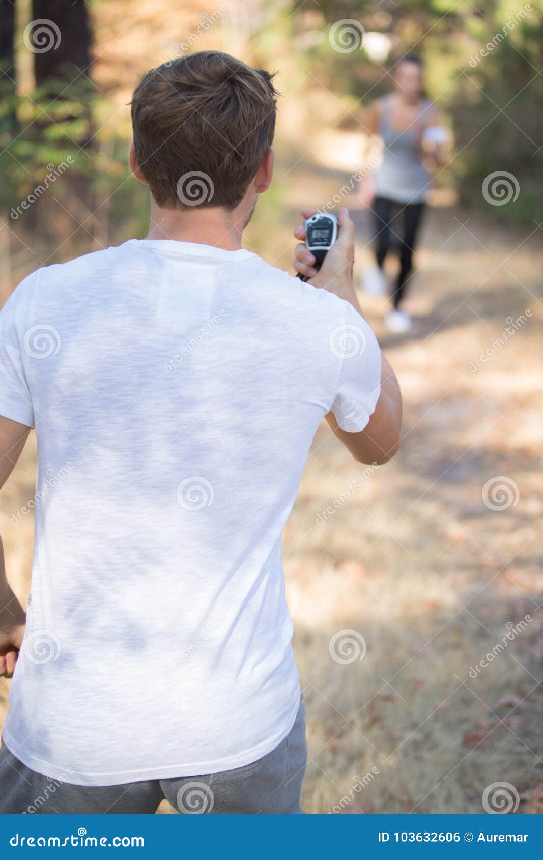 Personal Trainer Timing Female Runner Stock Photo - Image of fitness ...