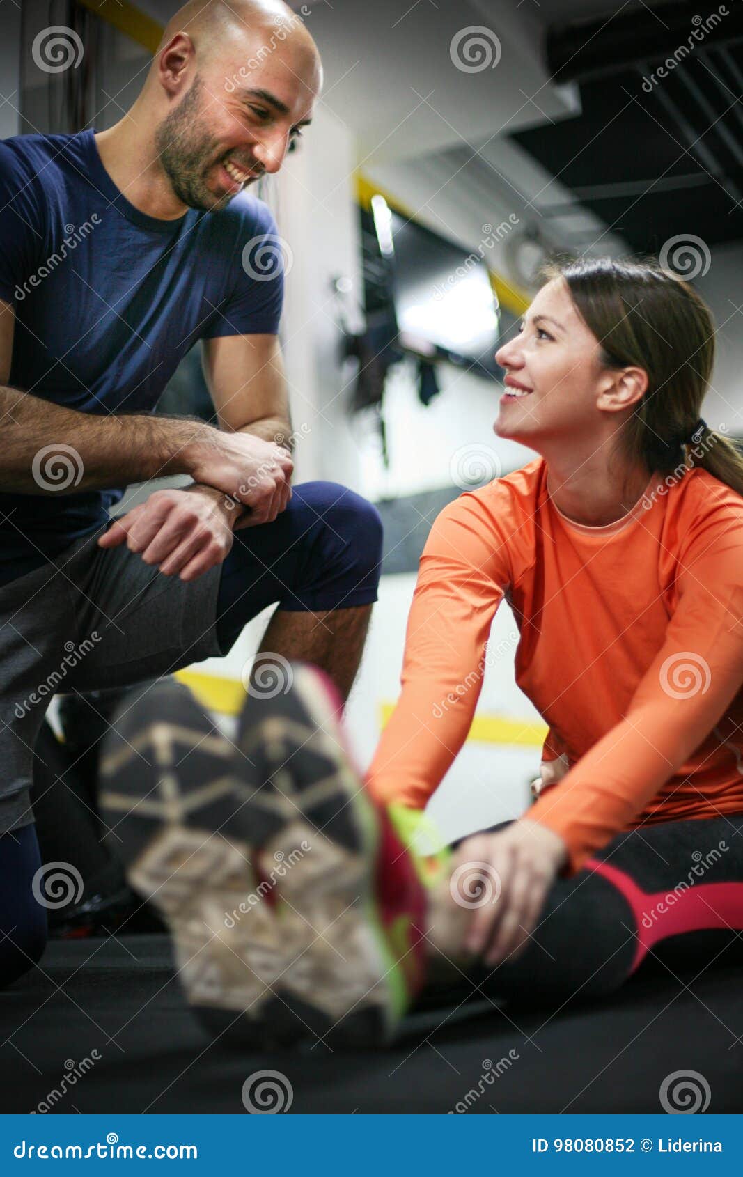 Personal Trainer Training His Client in the Gym. Stock Photo - Image of ...