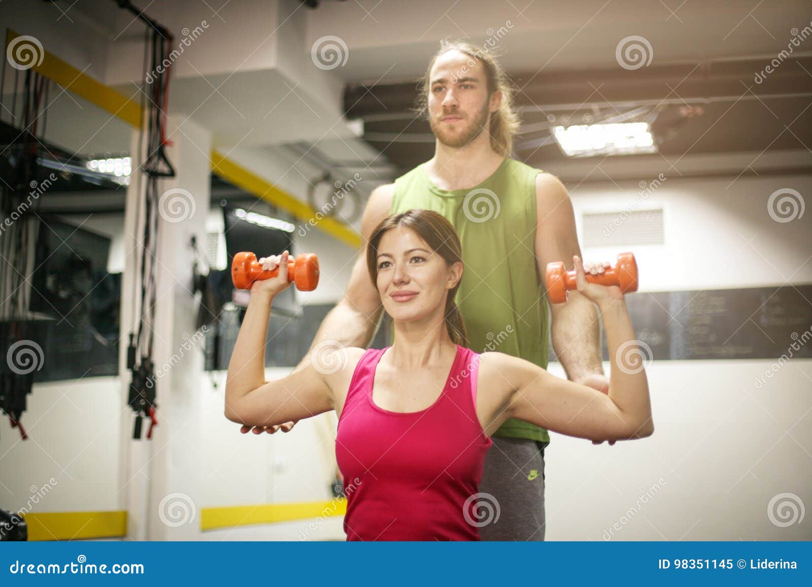 Personal Trainer Training His Client in the Gym. Stock Image - Image of ...