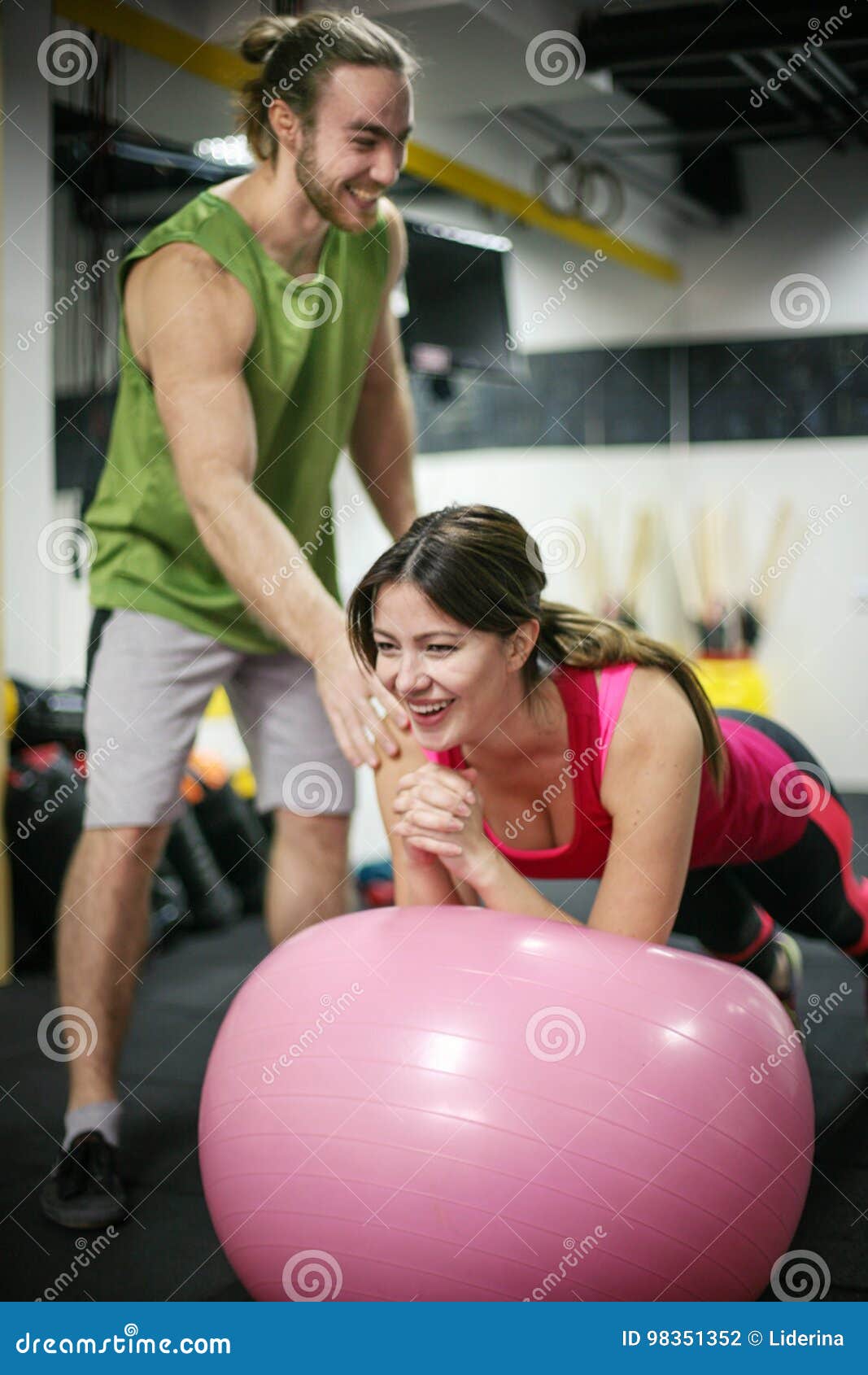 Personal Trainer Training His Client in the Gym. Stock Photo - Image of ...