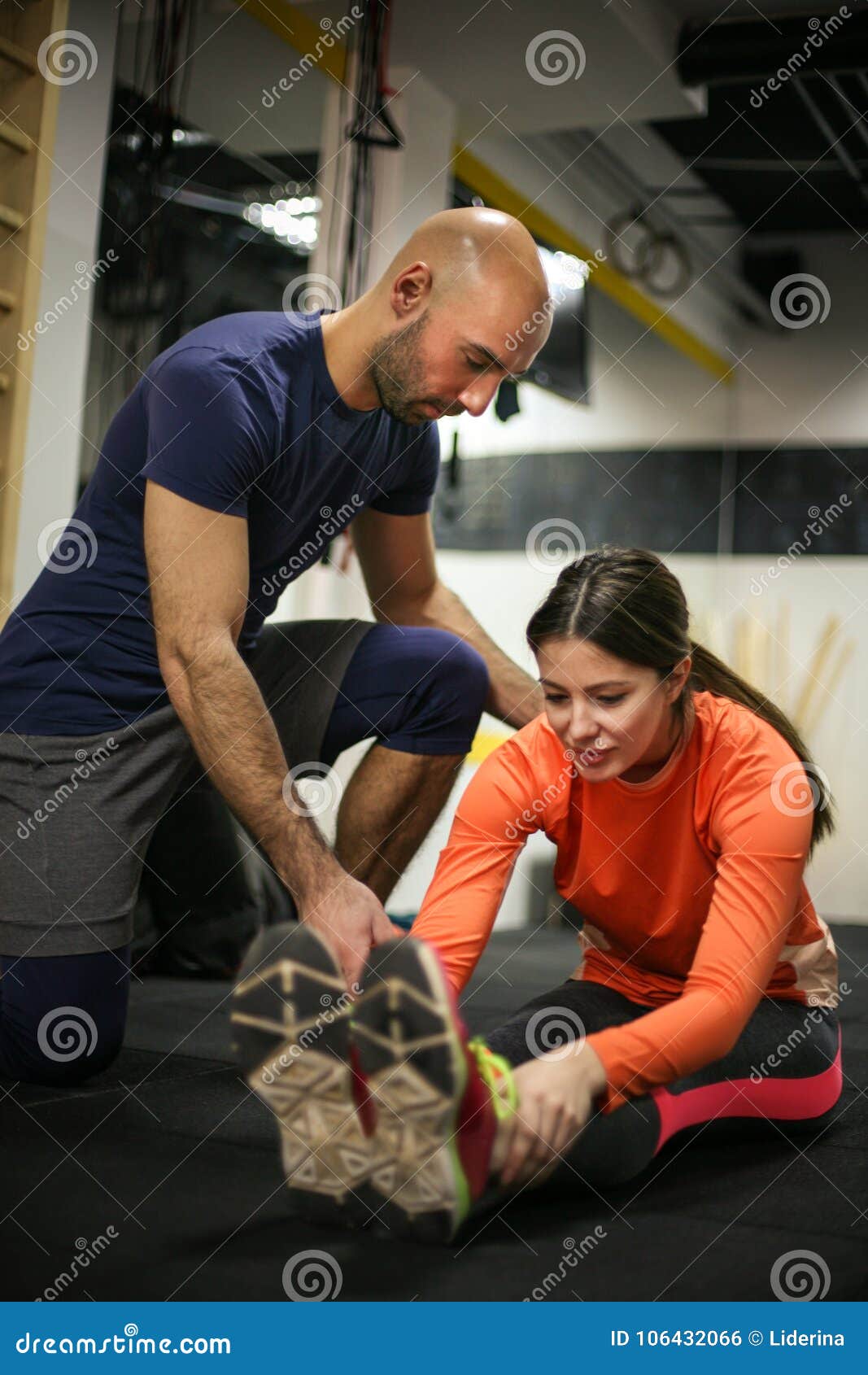 Personal Trainer Training His Client in the Gym. Stock Photo - Image of ...