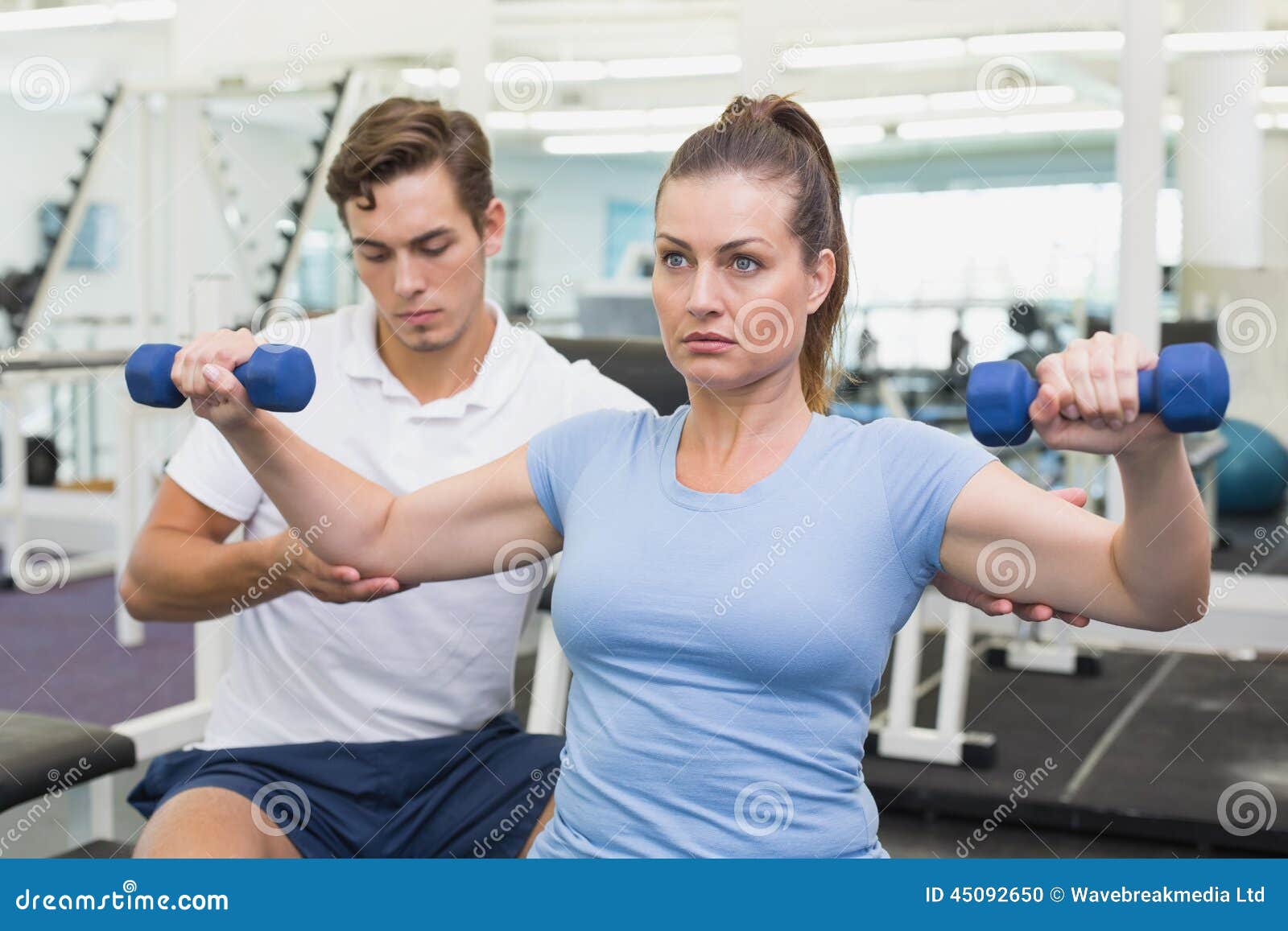 Personal Trainer Working with Client on Exercise Ball Stock Photo ...