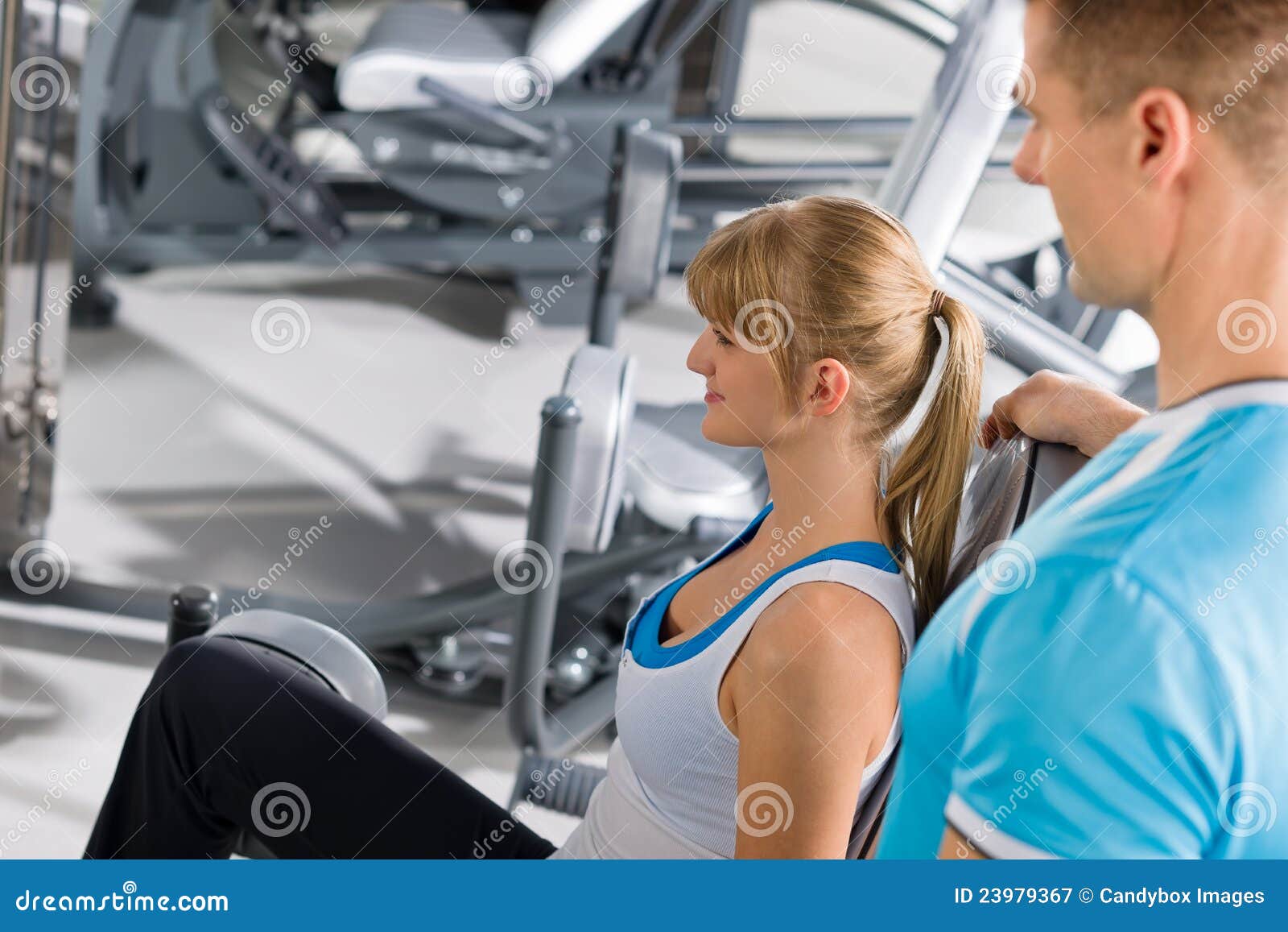 Personal Trainer with Young Woman at Gym Stock Image - Image of legs ...