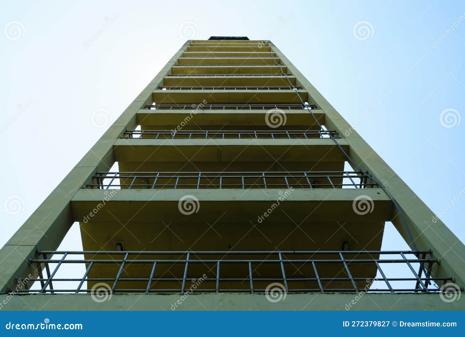 Perspective Upwards of a Building with a Fence Stock Image - Image of ...