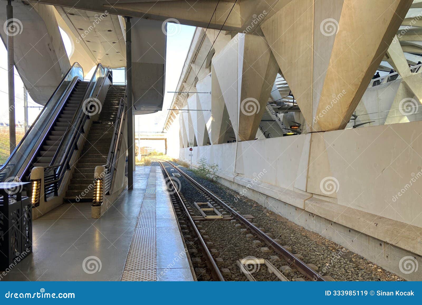 Deserted Train Station Platform With Rusty Tracks And Overgrowth Stock ...