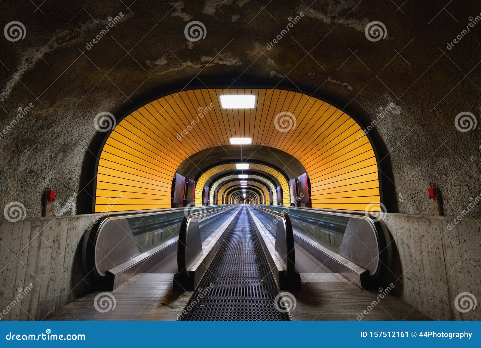 Illuminated Travelator And Directional Signs Stock Photography ...