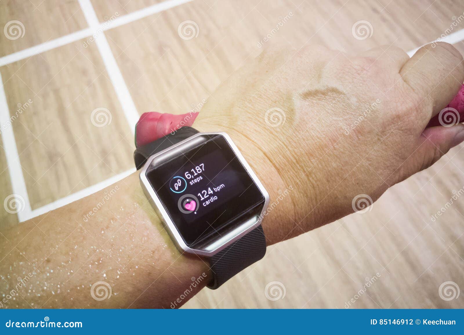 Perspective View Person Reading Watch with Steps and Heart Tracker ...