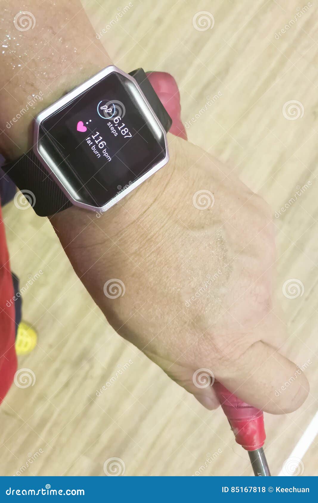 Perspective View Person Reading Watch with Steps and Heart Tracker ...