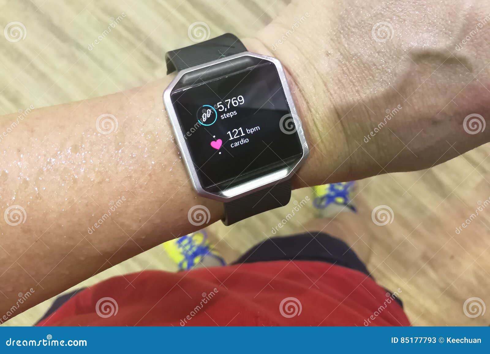 Perspective View Person Reading Watch with Steps and Heart Tracker ...