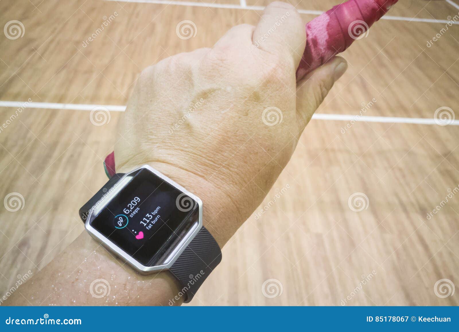 Perspective View Person Reading Watch with Steps and Heart Tracker ...