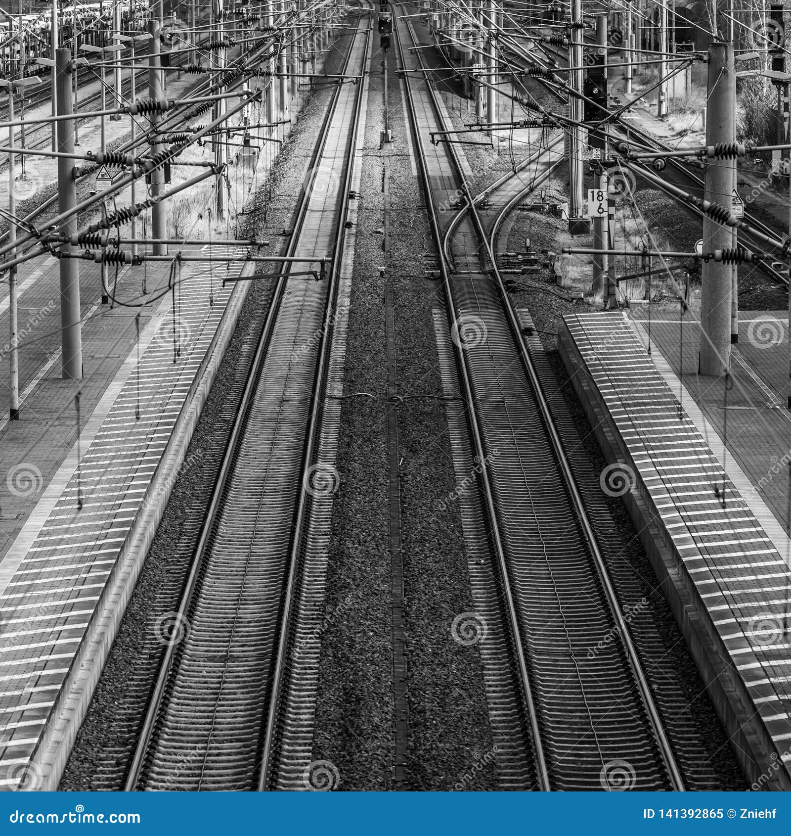 Perspective View of Railway Tracks with Overhead Lines Next To a ...