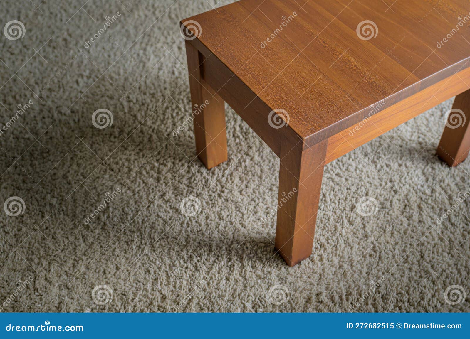 Perspective View of Small Teak Table on Beige Carpet. Stock Image ...