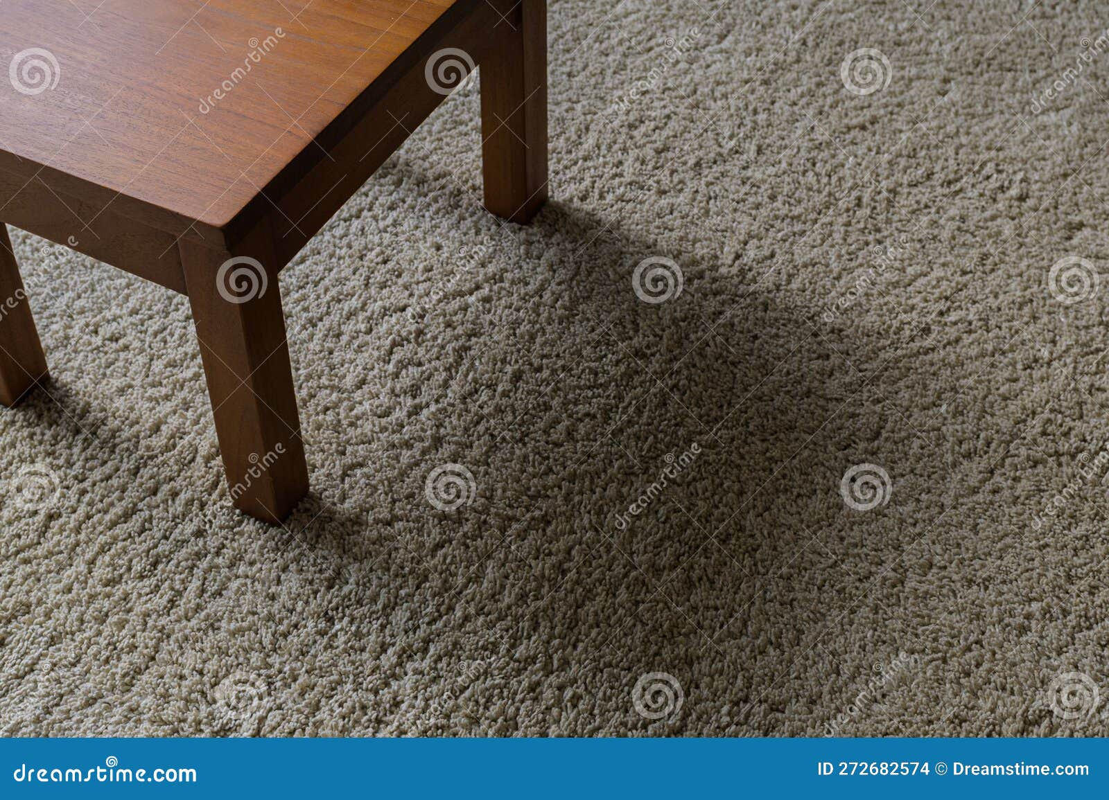 Perspective View of Small Teak Table on Beige Carpet. Stock Photo ...