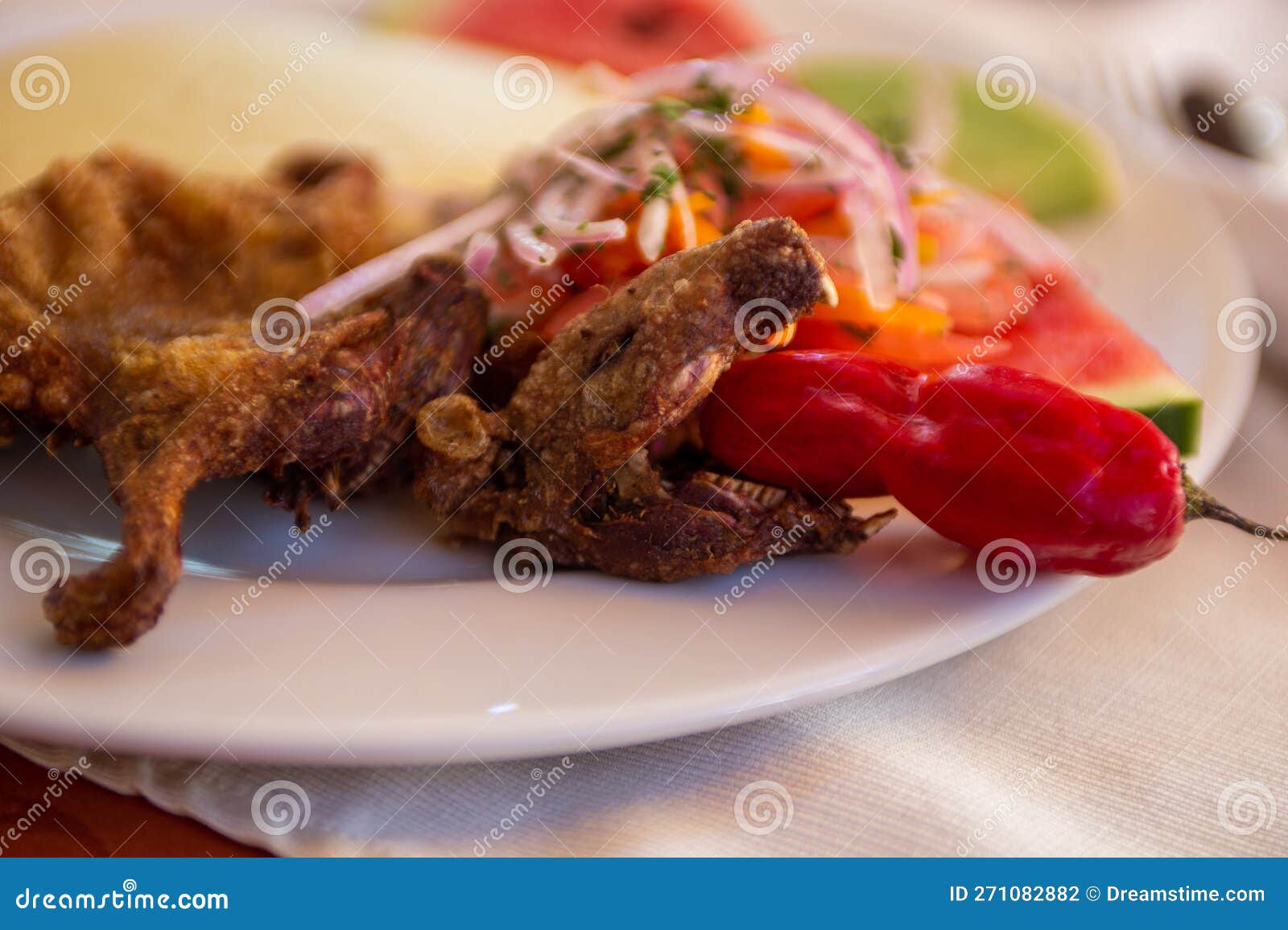 Peruvian Cuy Served on a Plate Stock Photo - Image of onions ...