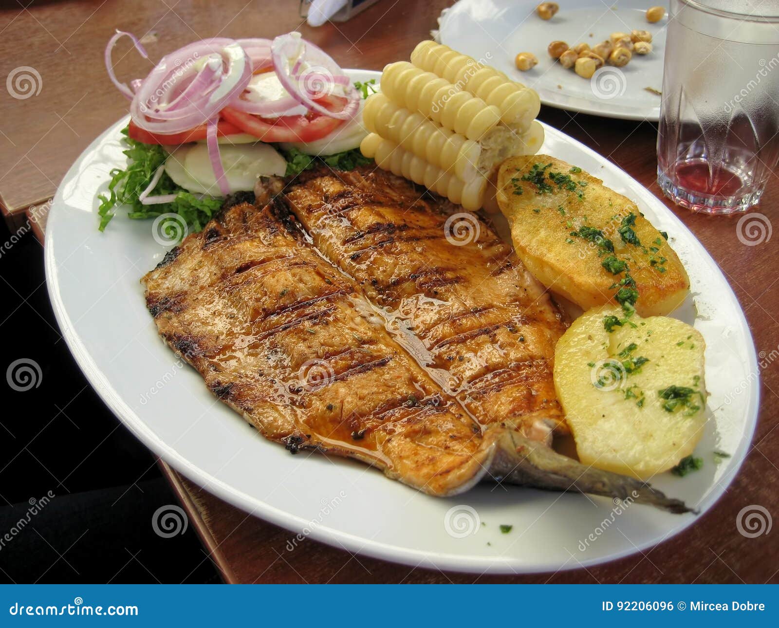 Peruvian Dish - Fried Fish Fillet with Vegetables, Onion, Corn, Boiled ...