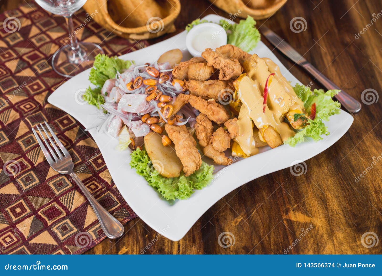 Peruvian Piqueo, Huancaina Potatoes, Lettuce and Ceviche Stock Photo ...
