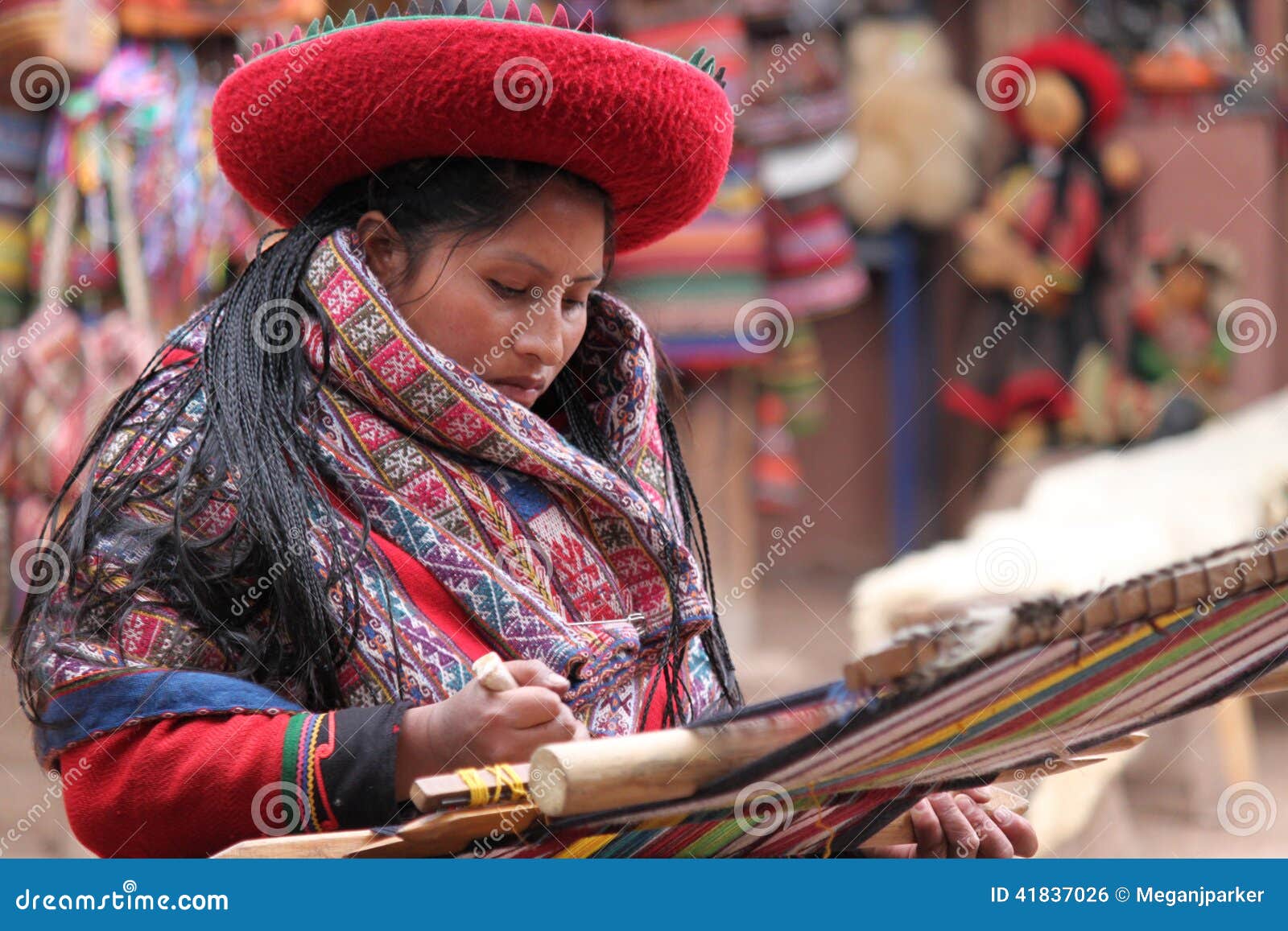Peruvian Woman In Traditional Clothing Weaving Cloth On A Loom Stock ...