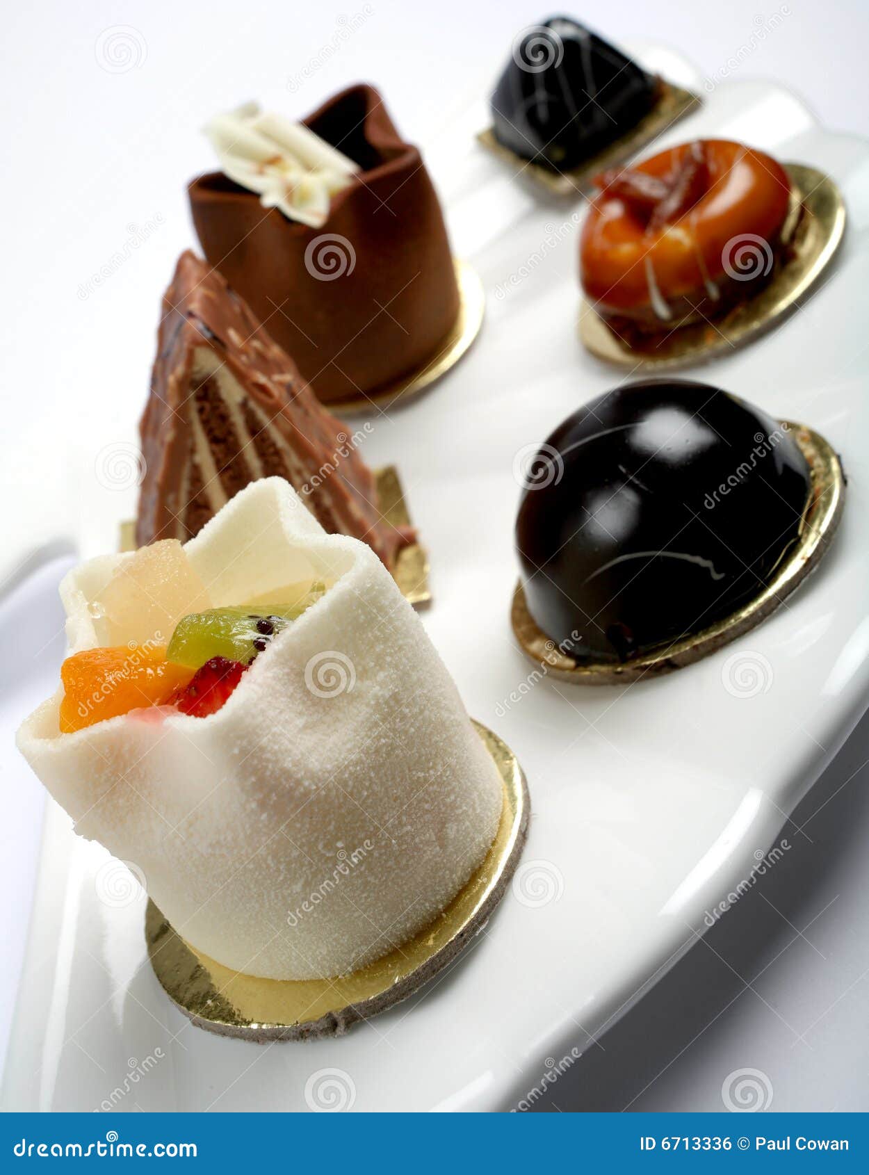 Petits Fours Cakes on a Plate Stock Photo - Image of petits, mousse ...