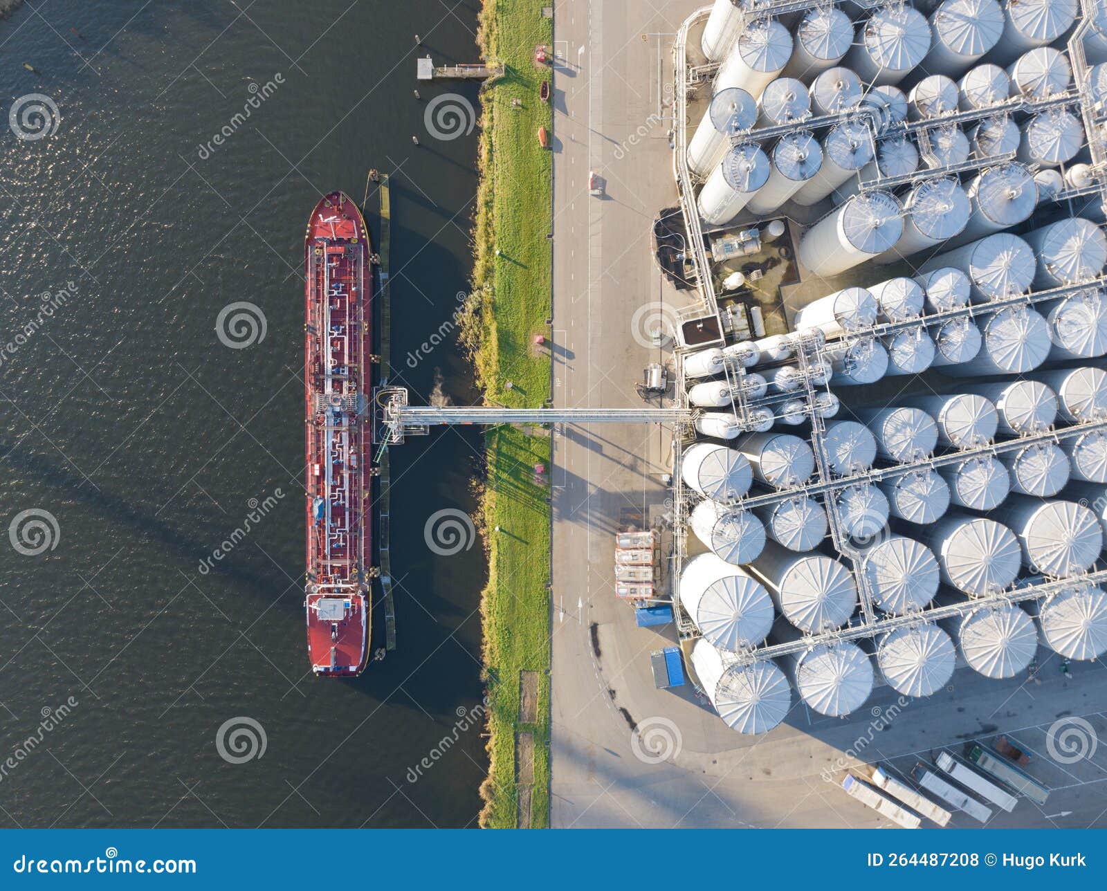 Petrochemical Loading of Ship at Loading Dock with Pipelines and ...