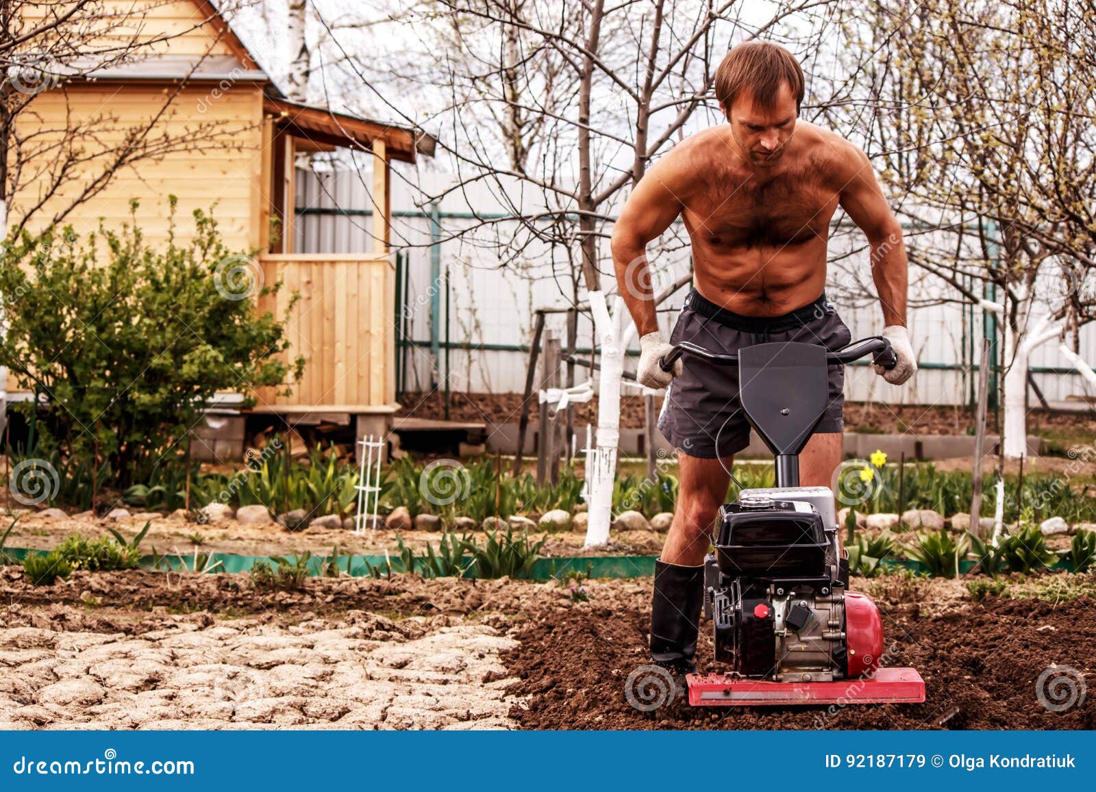 Tiller In Action Digging And Spewing Dirt And Soil Stock Image ...