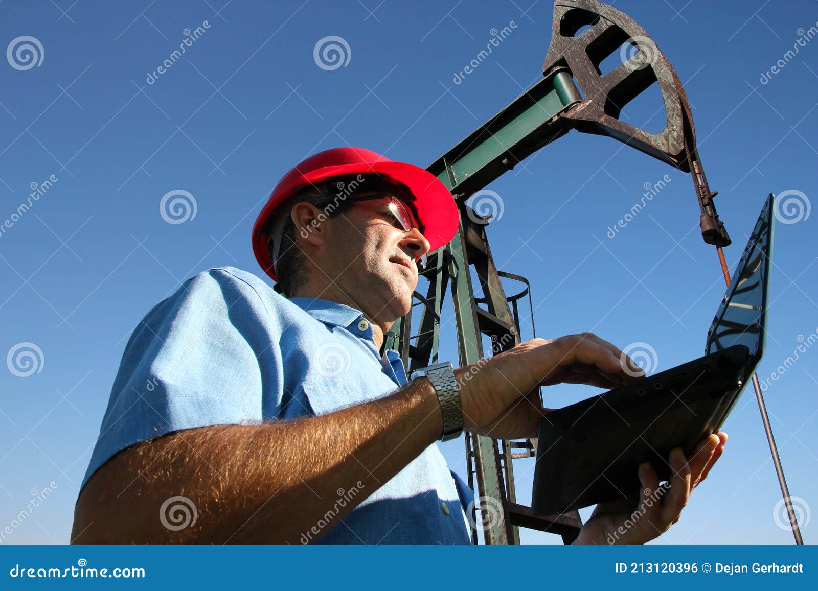 Petroleum Engineer Working In Extracting Oil Industry Using Mobile ...