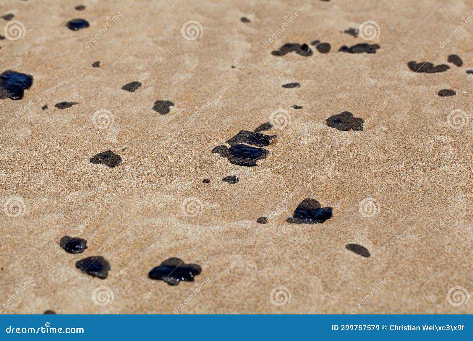 Petroleum stains on sand stock image. Image of environment - 299757579