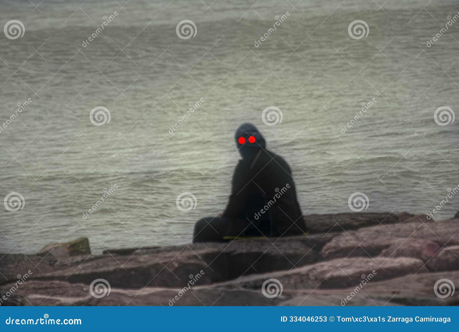 Phantom with Red Eyes Sitting on a Rock Near the Sea Stock Image ...